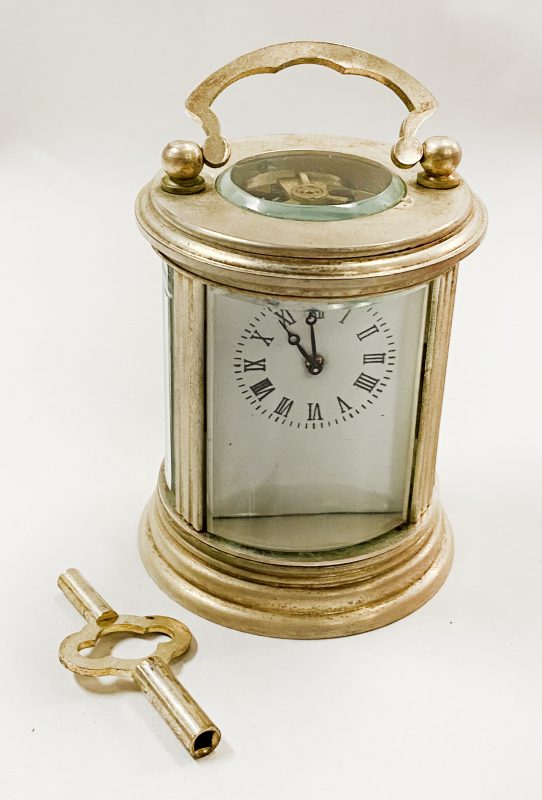 ROUND CARRIAGE CLOCK & KEY - Southgate Auction Rooms
