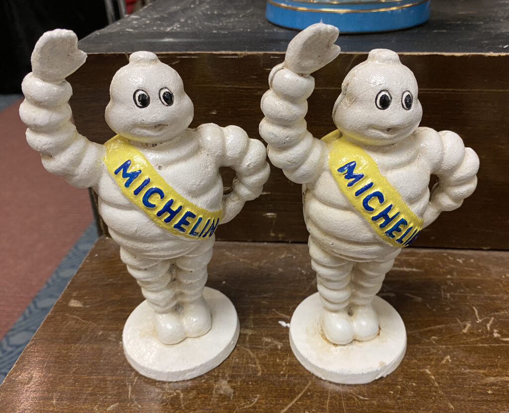 PAIR CAST IRON MICHELIN MAN MONEY BOXES - Southgate Auction Rooms