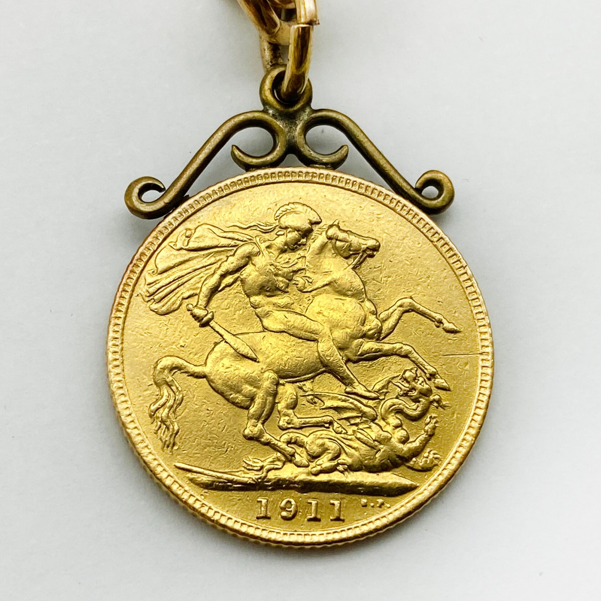 9CT GOLD FOB CHAIN WITH A FULL 1911 SOVEREIGN - 52.6 GRAMS IN TOTAL ...