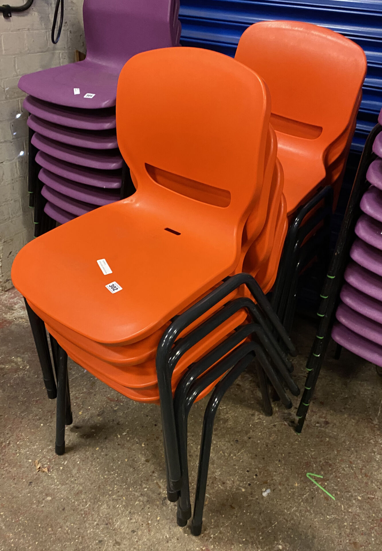 ERCOL SHELL ORANGE STACKING CHAIRS - Southgate Auction Rooms