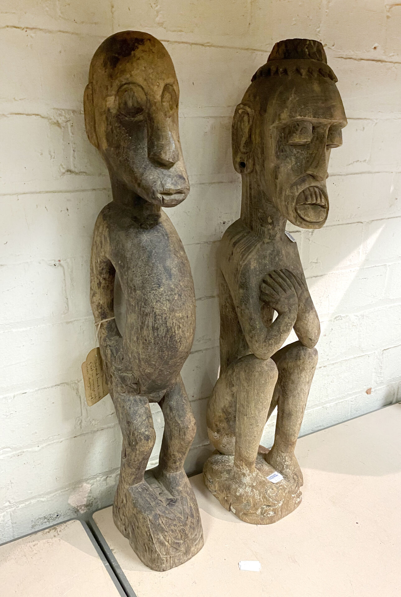 KALIMANTON WOODEN FIGURAL STATUES WITH STYLISE OF ASO DRAGON GOD ...