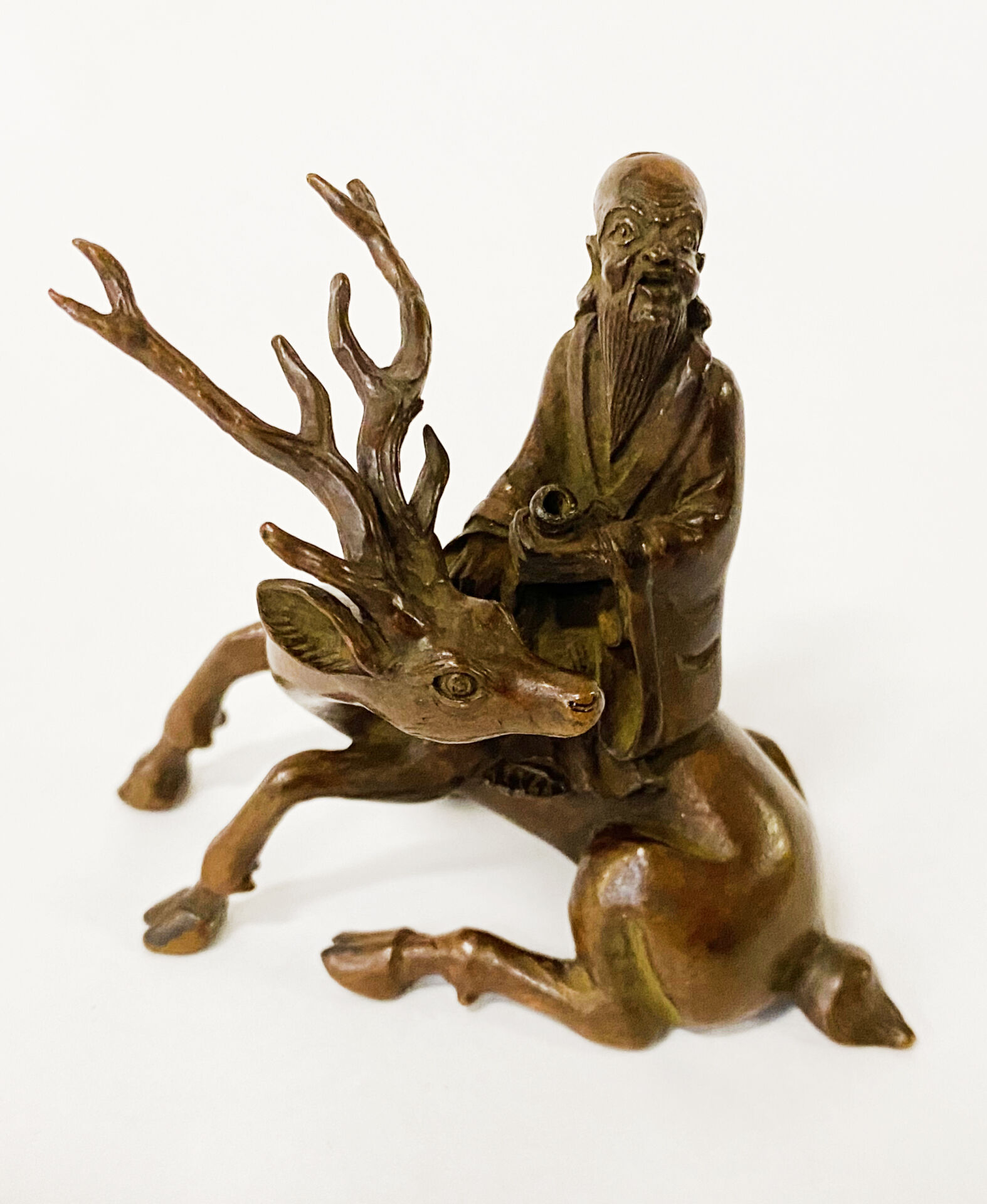 BRONZE GOD WITH DEER - Southgate Auction Rooms