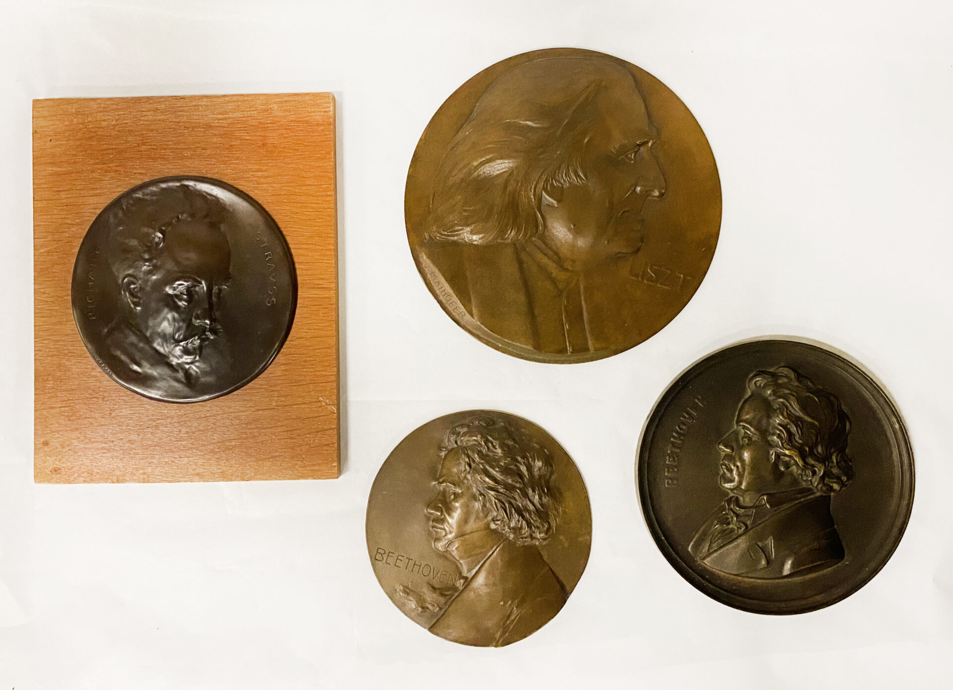 FOUR BRONZE COMPOSER THEMED RELIEFS - Southgate Auction Rooms